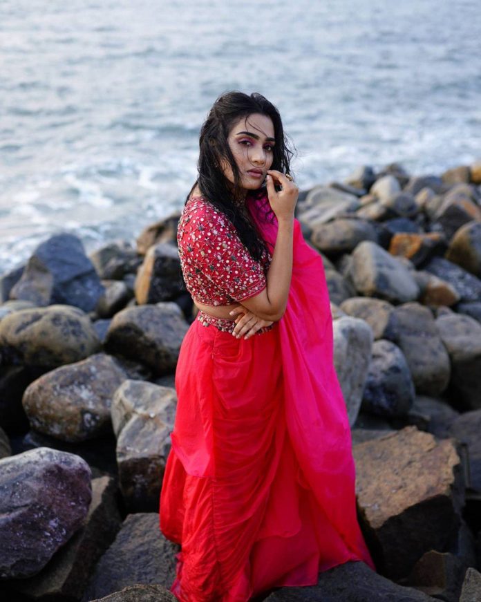 Aditi Ravi looks ravishing in a fuschia pink belt ruffle saree by Cameella!
