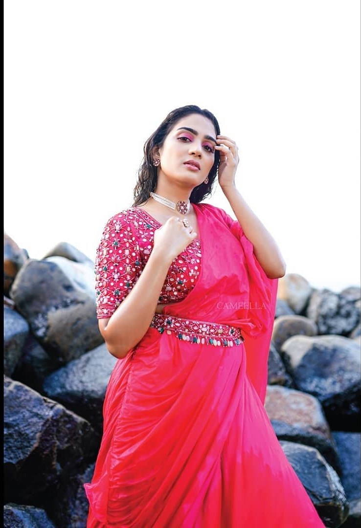 Aditi Ravi looks ravishing in a fuschia pink belt ruffle saree by Cameella!