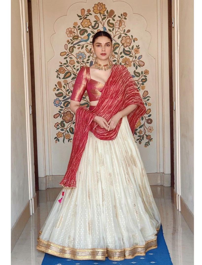 Aditi Rao Hydari is a resplendent wedding guest in an ivory lehenga!