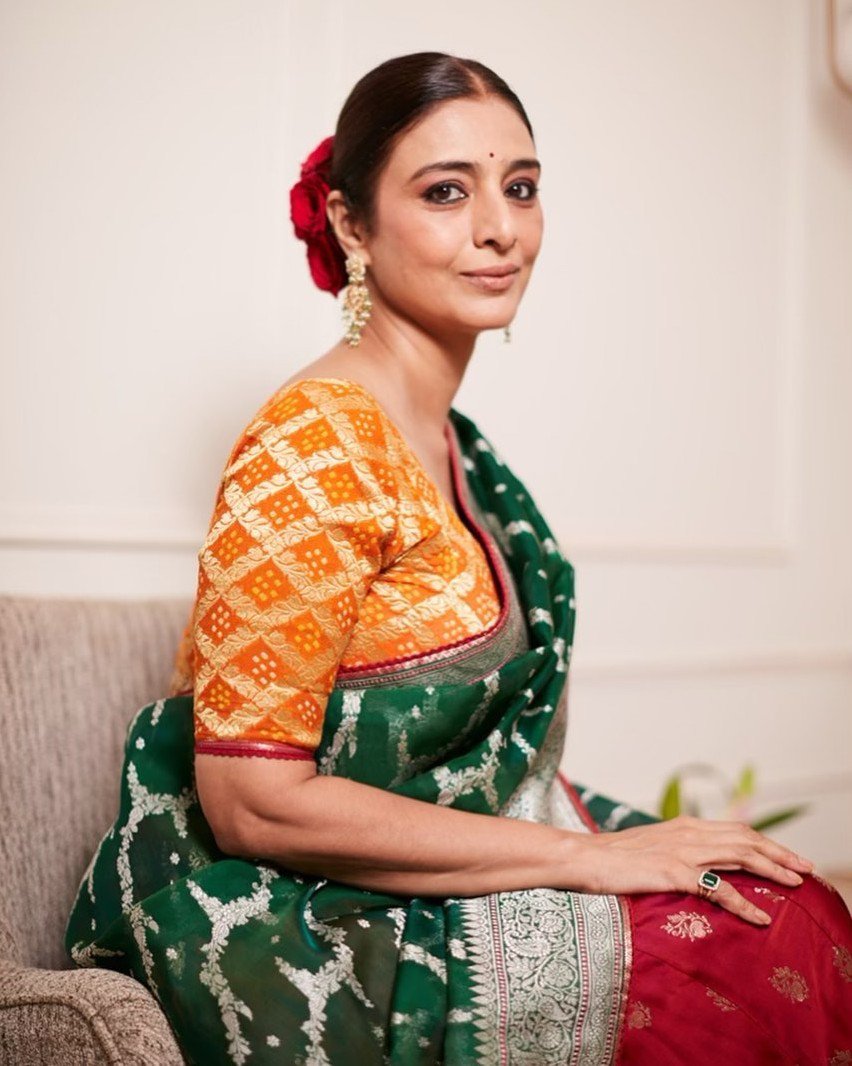 Tabu looks elegant in a red benarasi lehenga for a wedding!