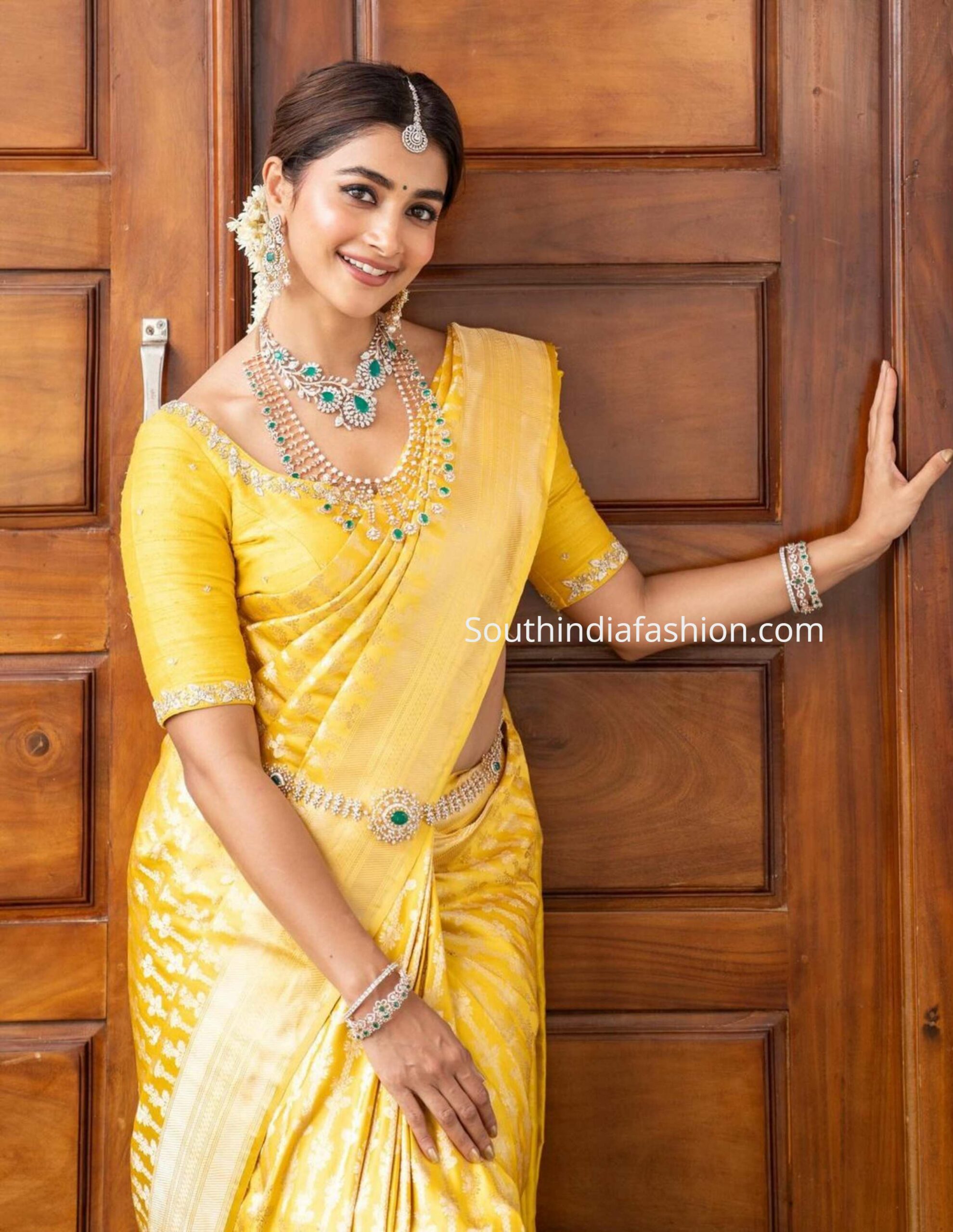 Pooja Hegde in a banarasi silk saree at a wedding – South India Fashion